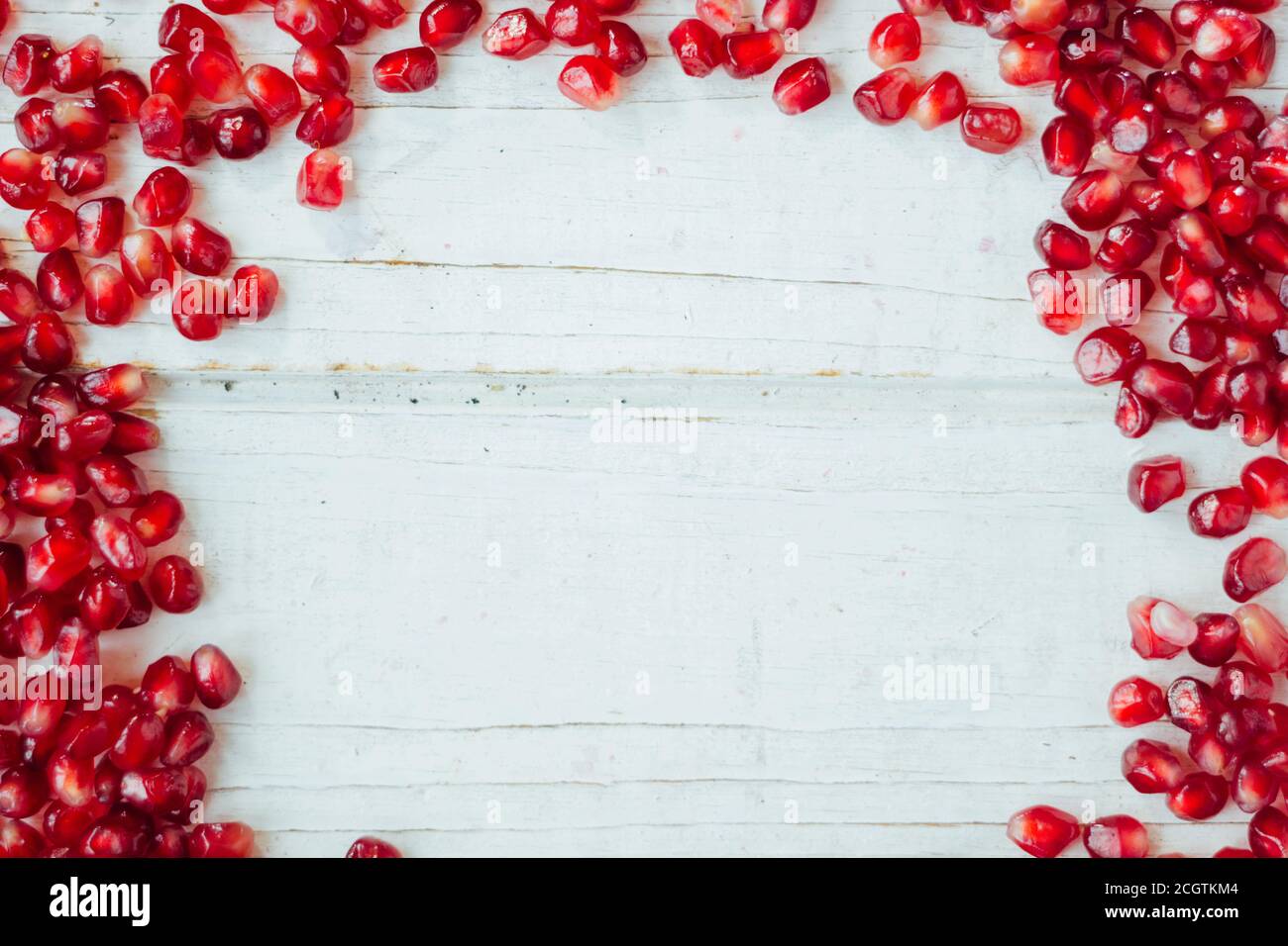 Red pomegranate border. Frame of pomegranate seeds Stock Photo - Alamy