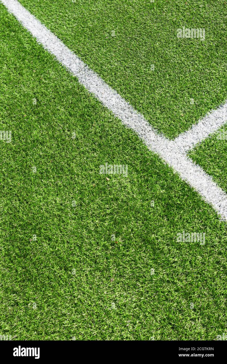 Green artificial grass turf soccer football field background with white ...