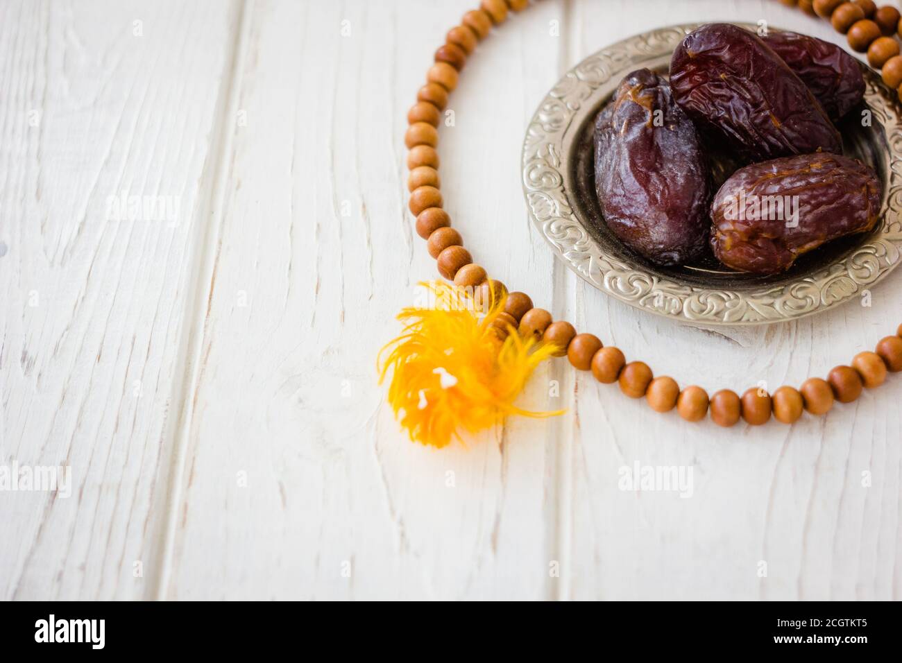 Dates on metal plate as iftar food during Ramadan month Stock Photo - Alamy