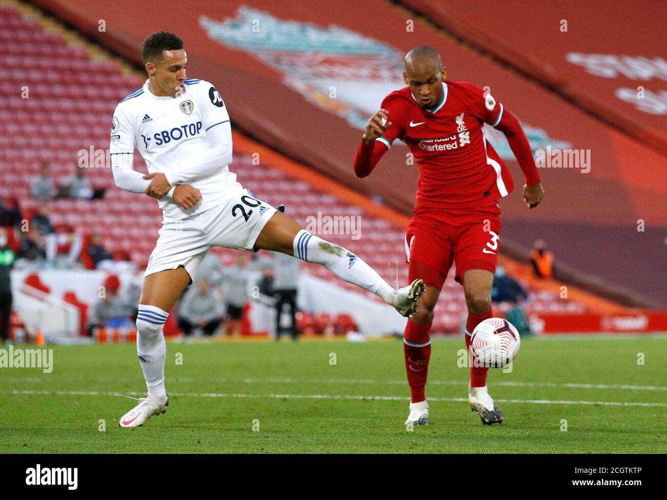 Leeds United's Rodrigo (left) brings down Liverpool's Fabinho inside ...