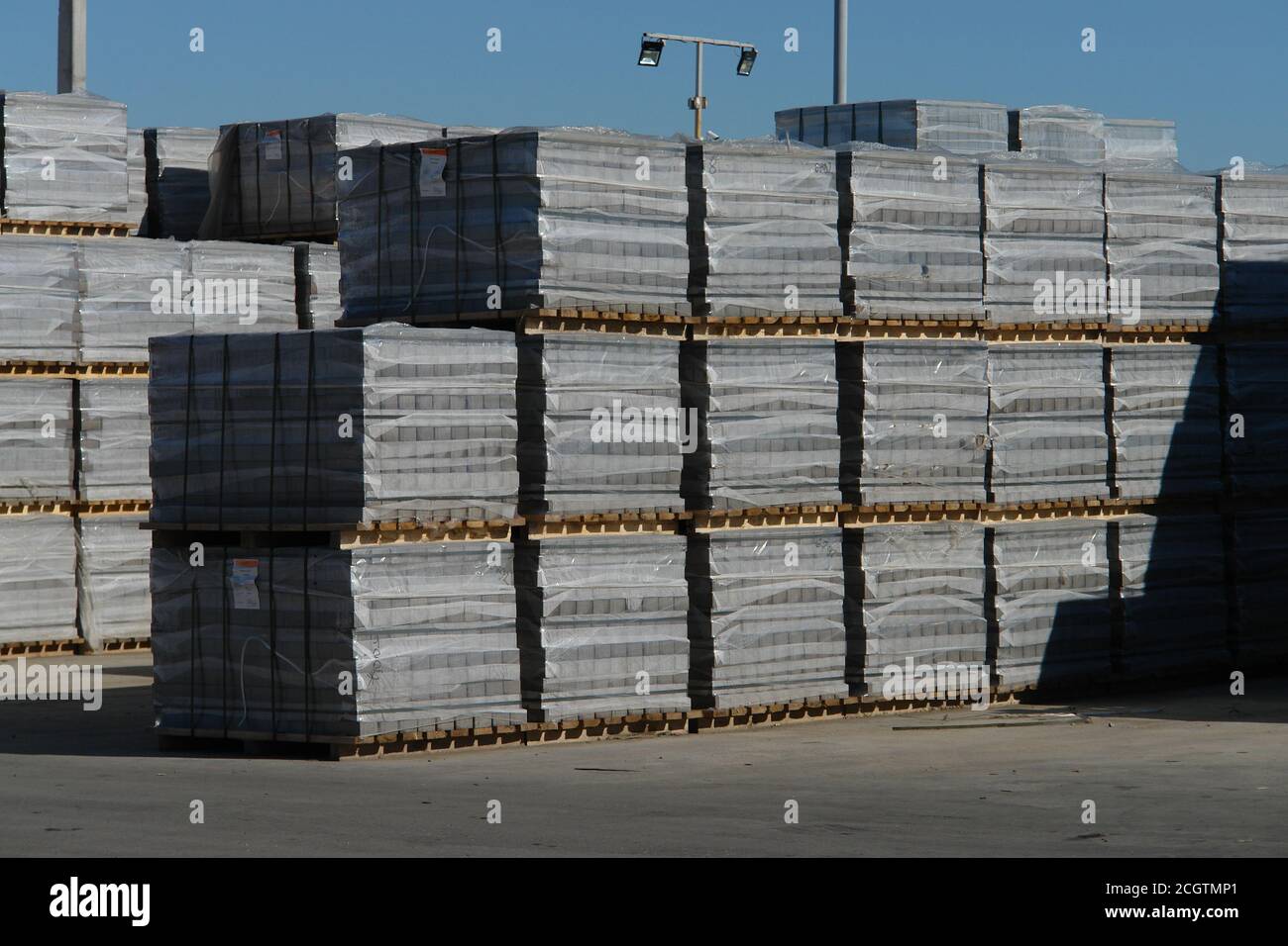 Pavement stones on market. Paving slabs store. Cobblestone on pallets ...