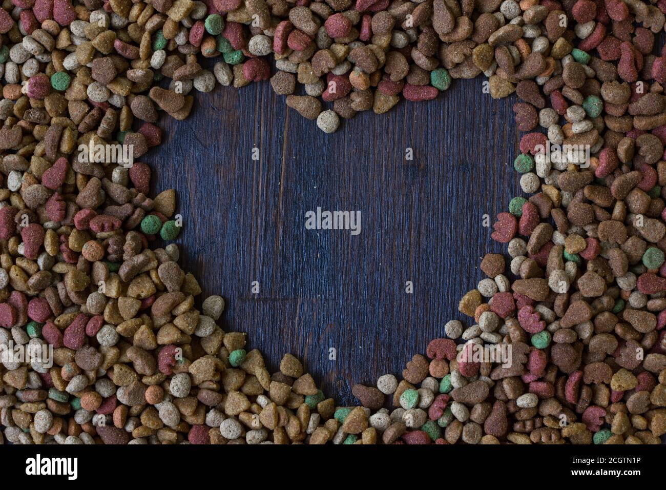 Shape of a heart on dry pet food. For text Stock Photo - Alamy
