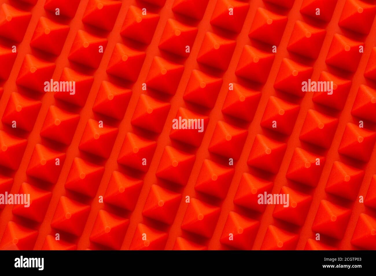 abstract red silicone pyramids array close-up background Stock Photo ...