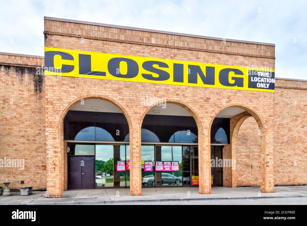 Horizontal shot of a bankrupt retail anchor store going out of business ...