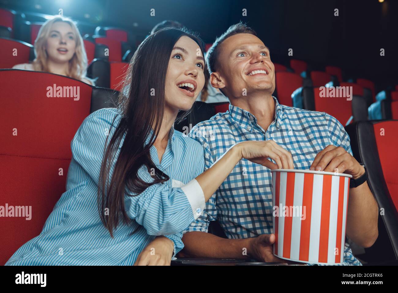 Young people friends together in the cinema Stock Photo - Alamy