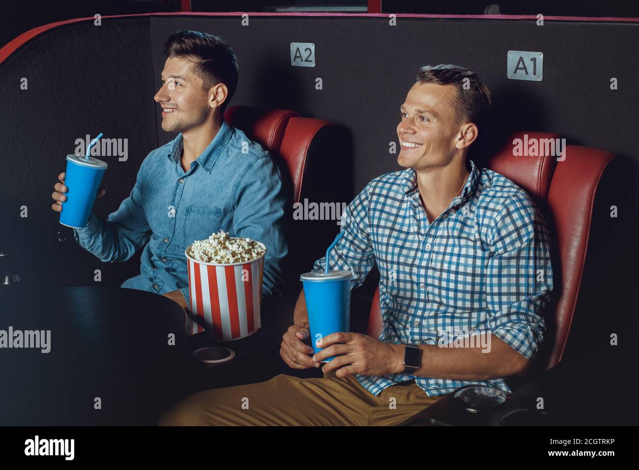 Young people friends together in the cinema Stock Photo - Alamy