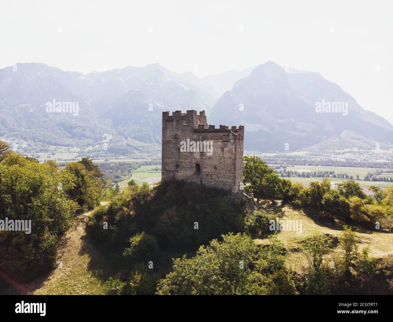 Ruins of Castle Wartau towering above the Rhine Valley in Werdenberg in ...