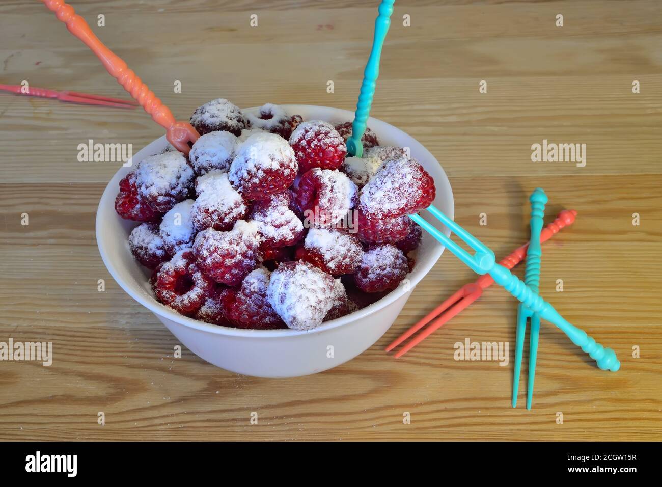 Ripe juicy red raspberry berries on skewers closeup Stock Photo - Alamy