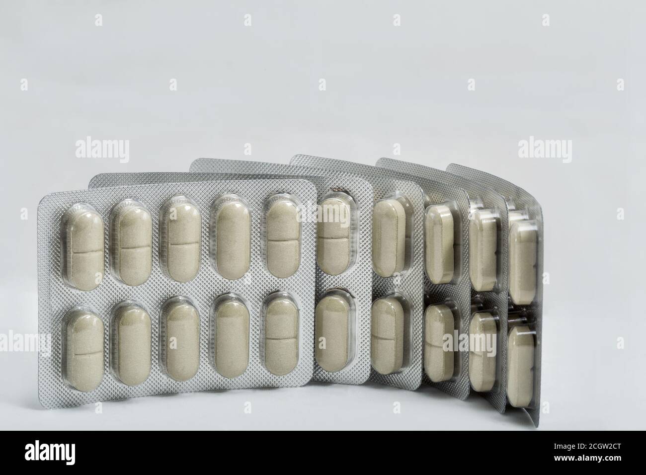 blisters with tablets closeup on white background Stock Photo - Alamy