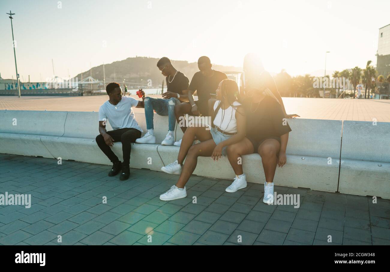 Group of young modern african black friends happily sitting together ...