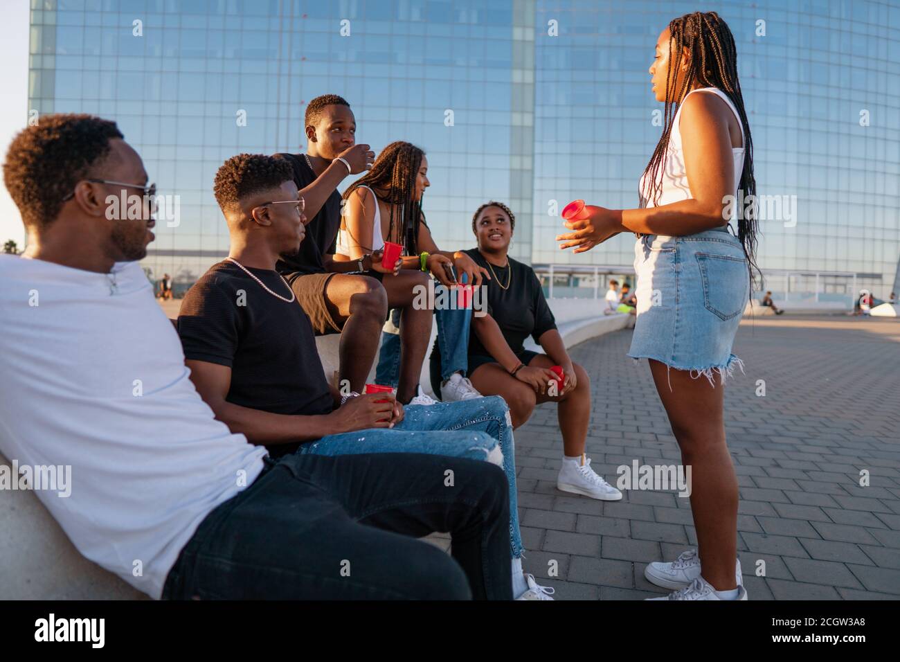 Group of young modern african black friends happily sitting together ...