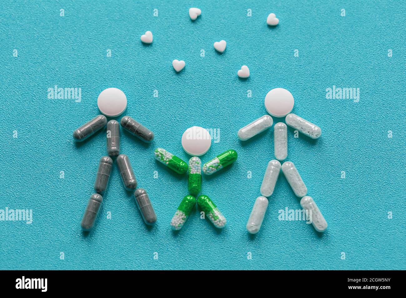 Creative healthcare concept made of drugs and pills, family holding ...