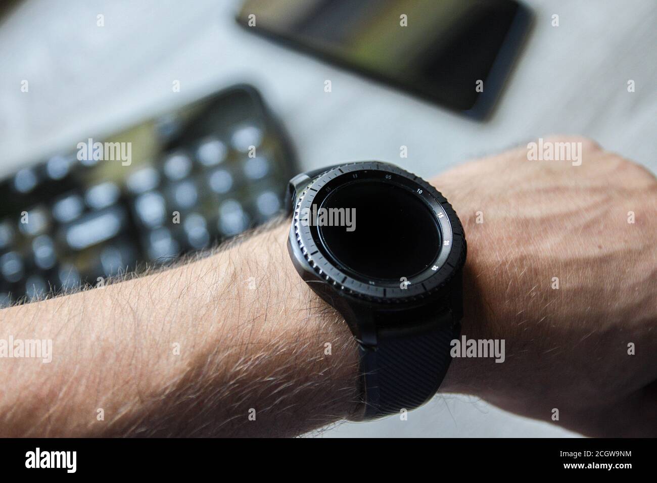 Smartwatch on the wrist. Held in a way that makes it easy to look at it ...