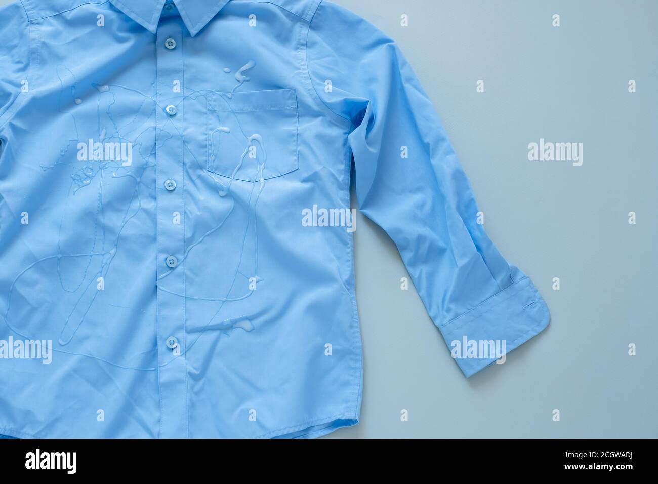 spilled glue on the shirt Stock Photo - Alamy