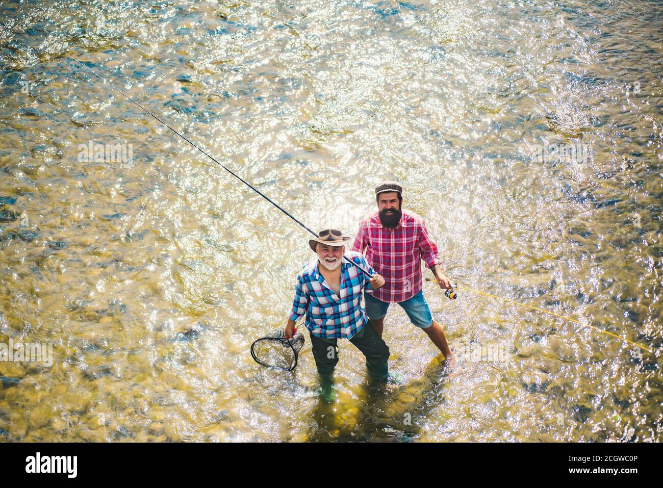 Elegant bearded men fishing. Relax in natural environment. Off limits ...