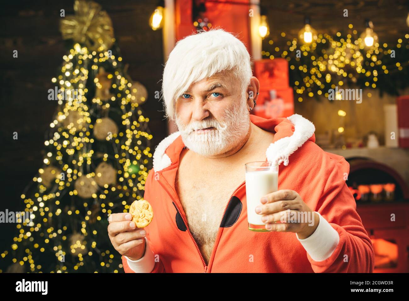 Christmas for modern Santa Claus. Santa make funny face and picking ...