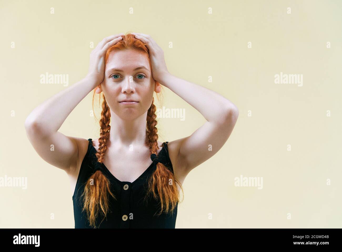 Beautiful restless girl holding her head. Turmoil and fuss concept with ...