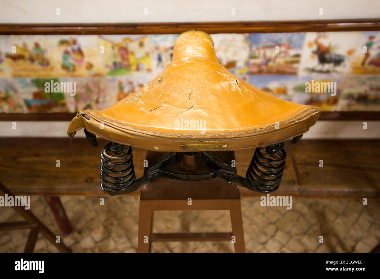 Original bar stools with leather bike saddle Stock Photo - Alamy