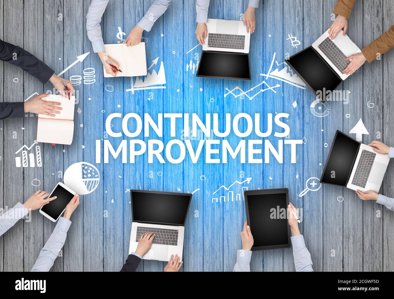 Group of Busy People Working in an Office with CONTINUOUS IMPROVEMENT ...