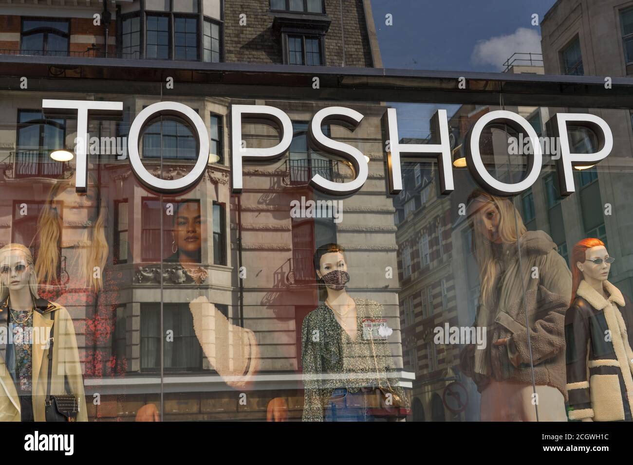 Topshop retail sign shop window with the street reflecting off the ...
