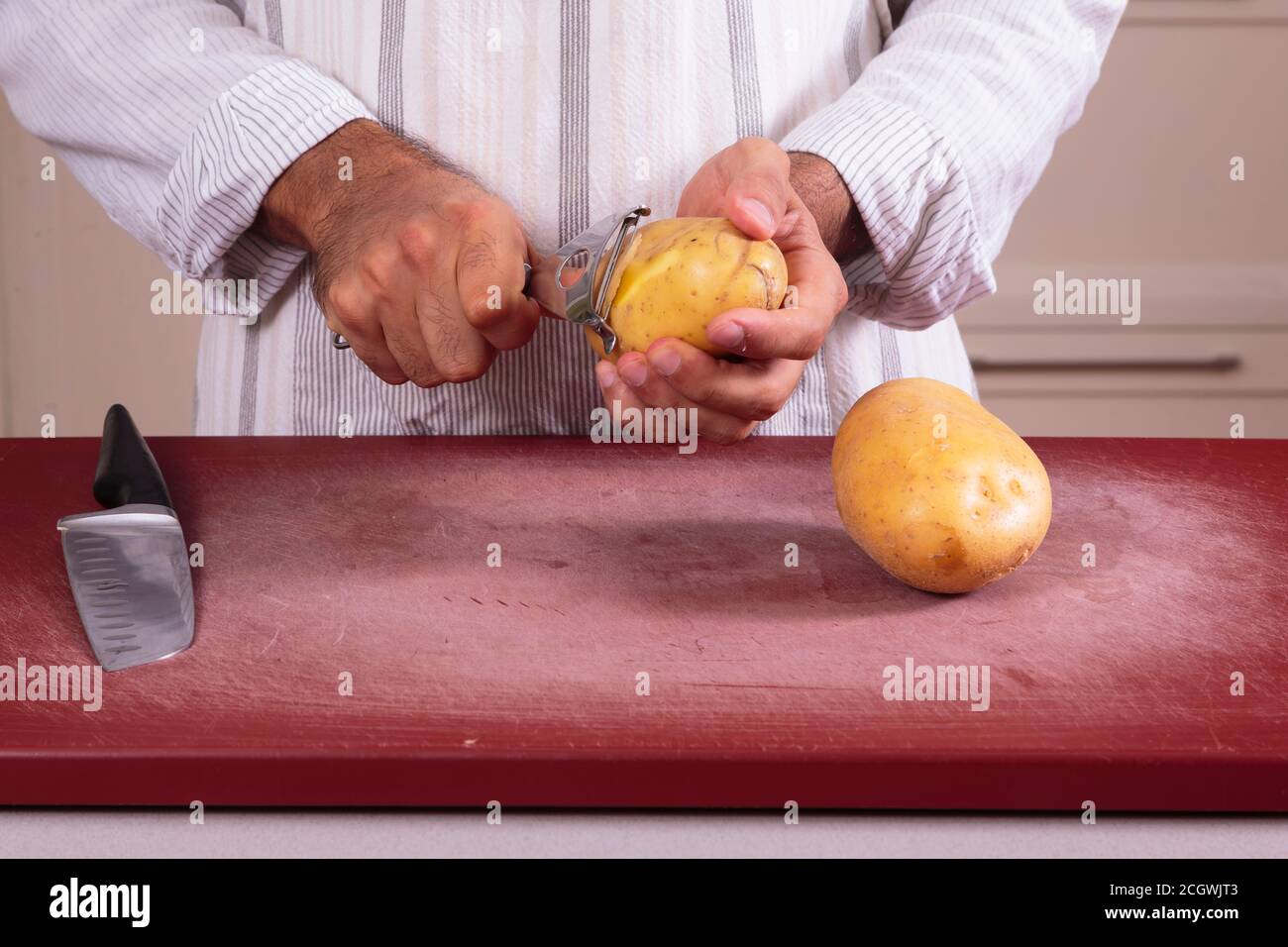 Peeling potato knife hi-res stock photography and images - Alamy