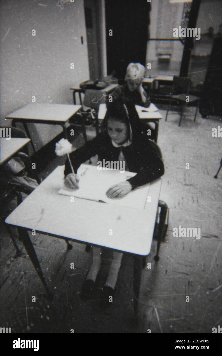 Fine 70s vintage black and white photography of student sitting at ...