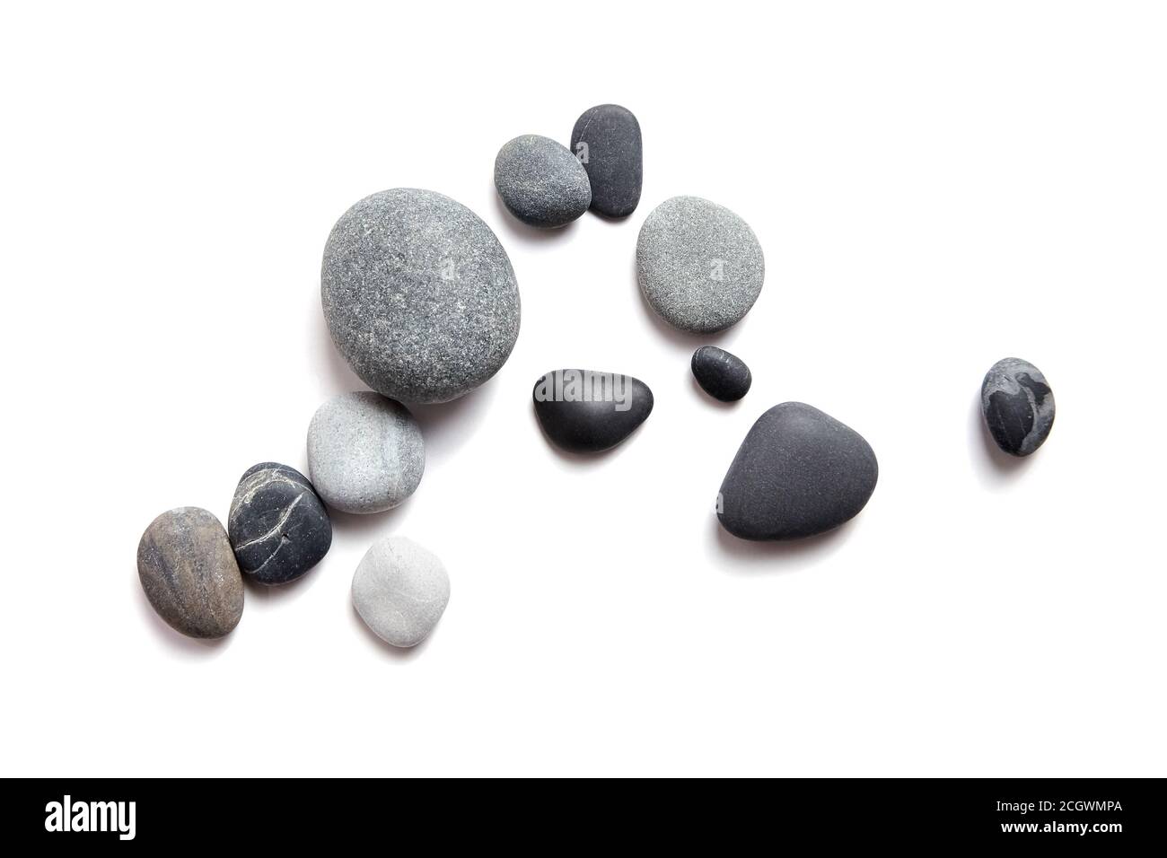 Scattered sea pebbles. Smooth gray and black stones isolated on white ...