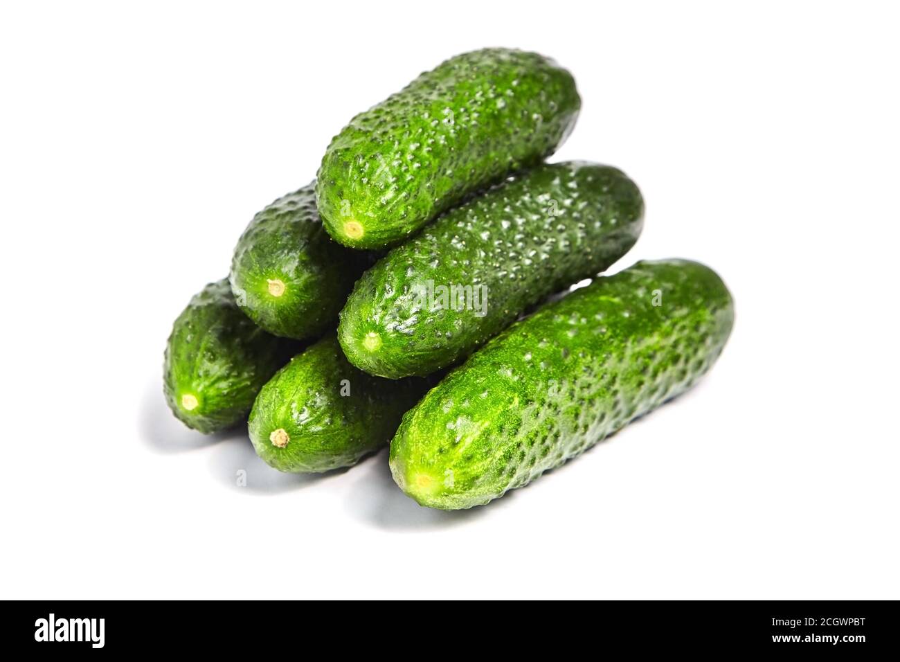 Pile of green fresh gherkins isolated on white background Stock Photo ...