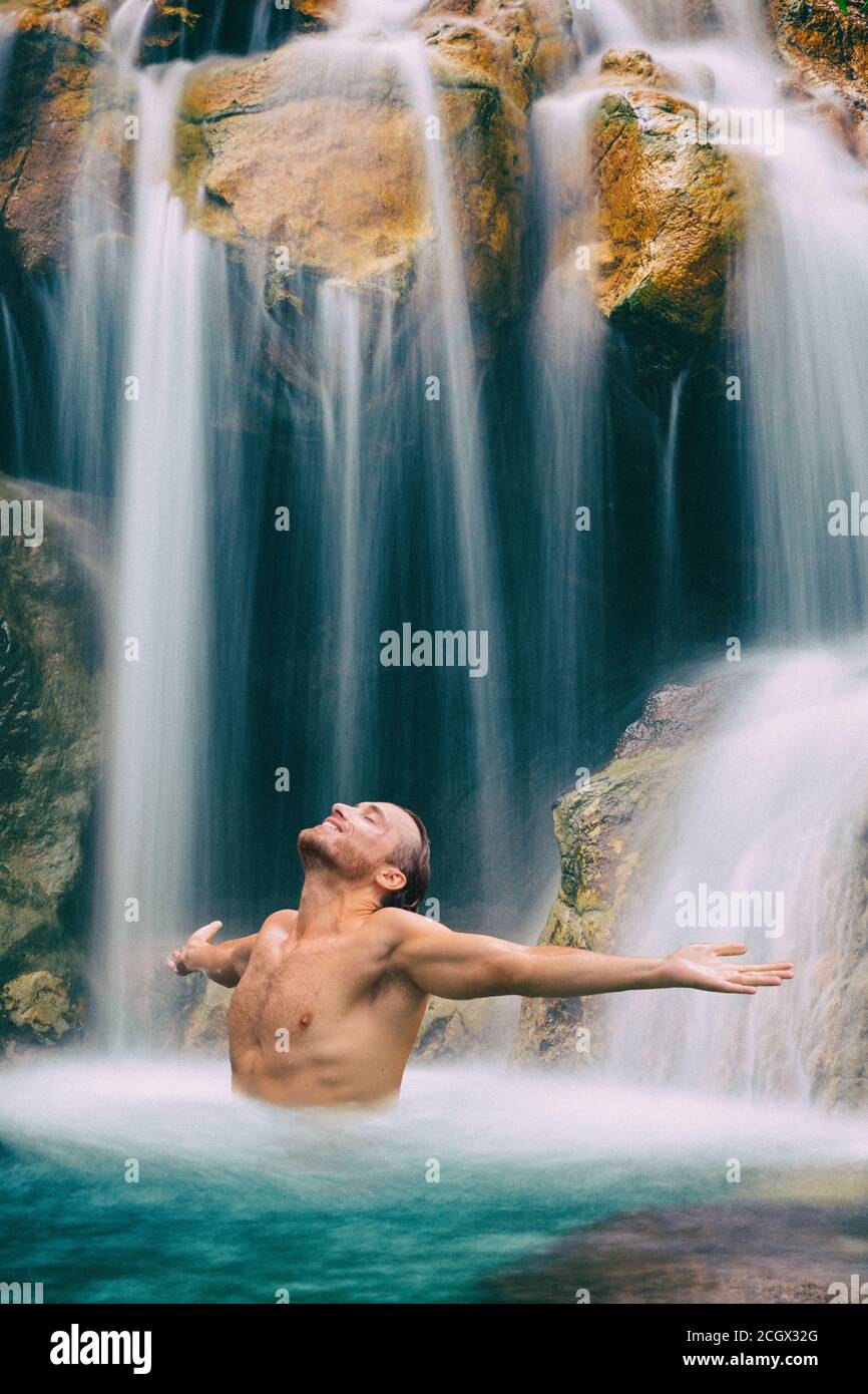 Man under waterfall hi-res stock photography and images - Alamy