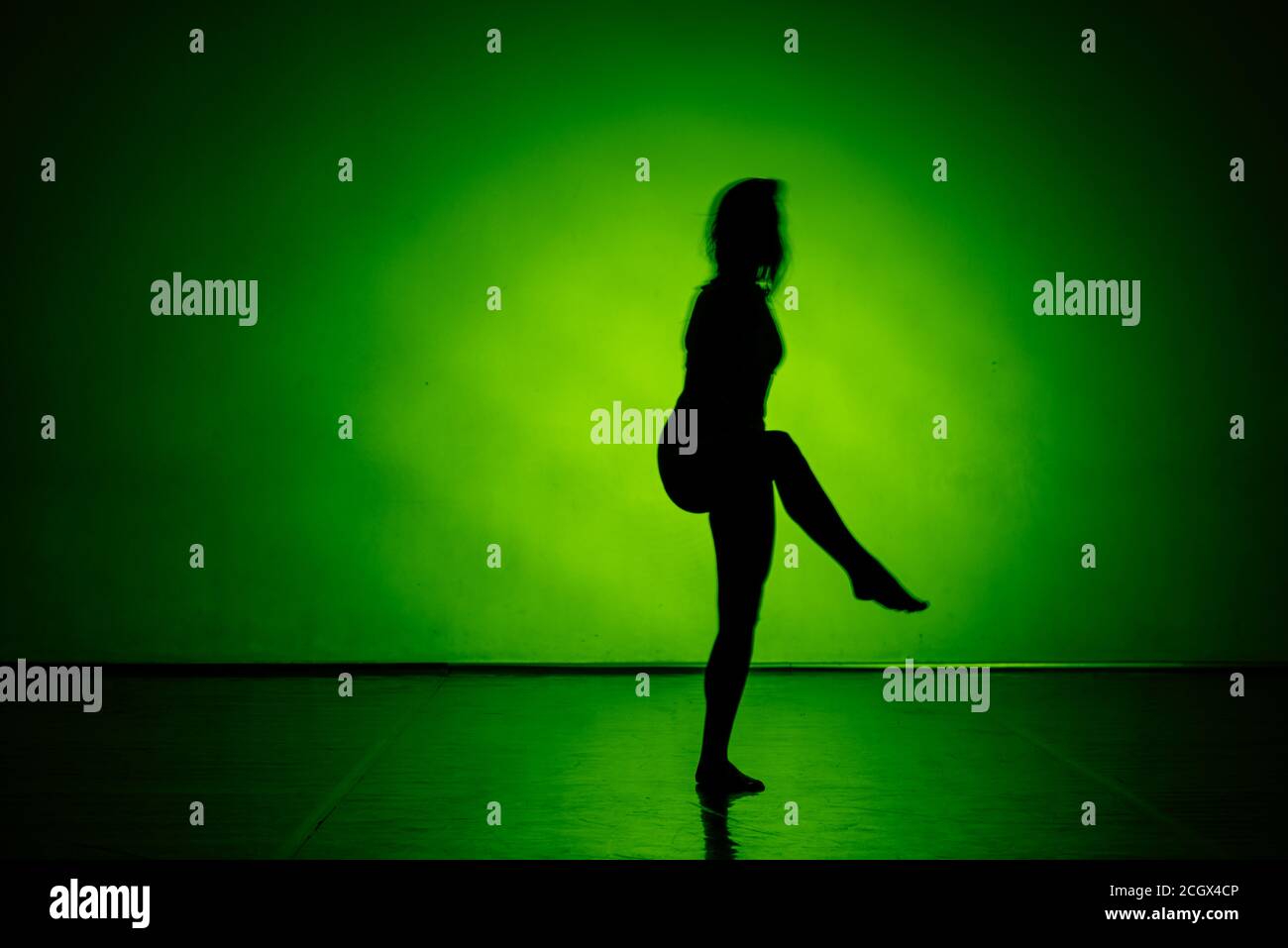 Athletic dancer performing an element of dance gymnastics Stock Photo ...