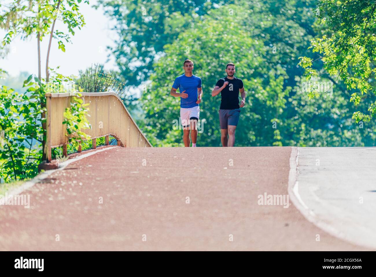 Boys running through forest hi-res stock photography and images - Alamy