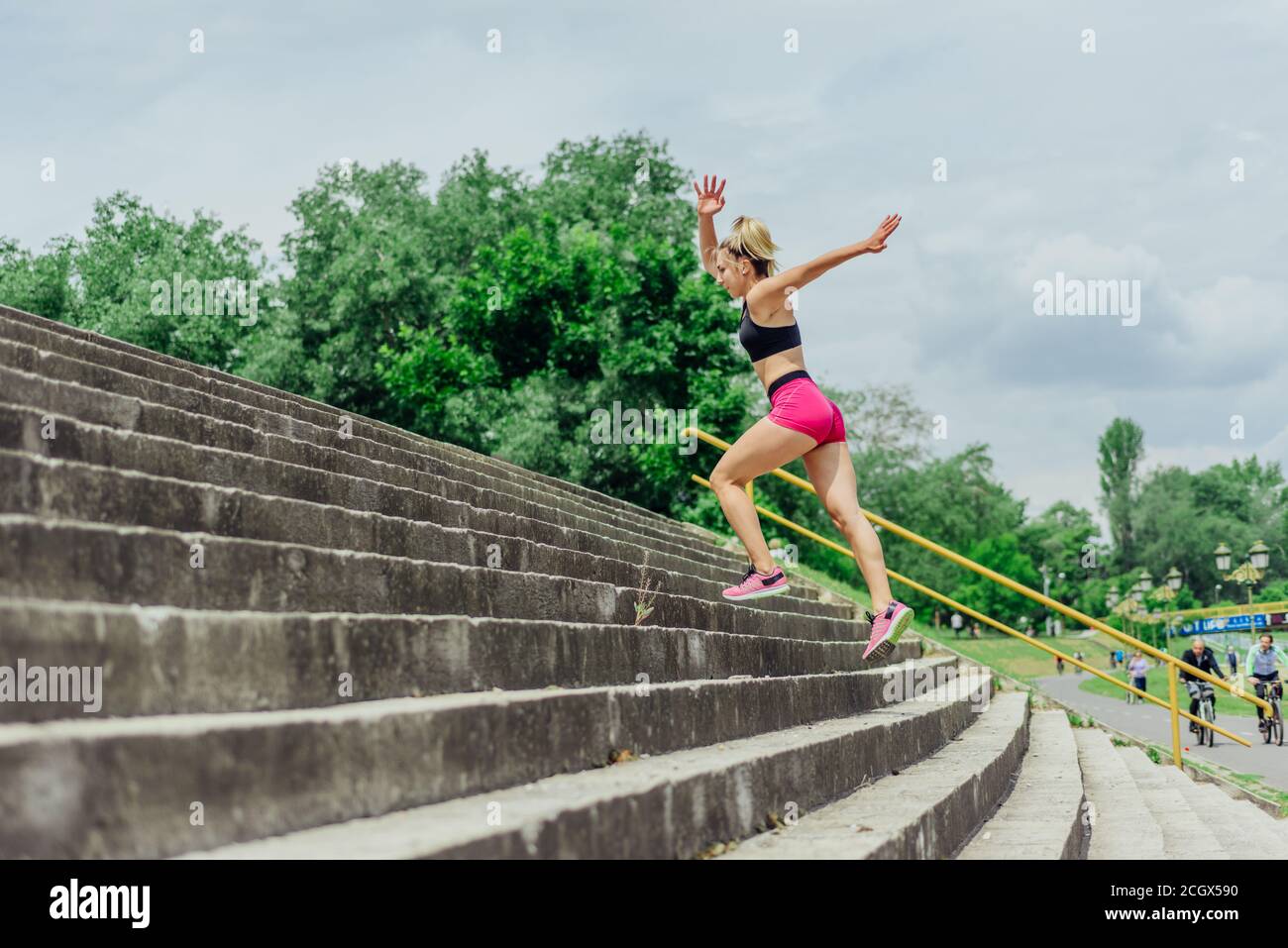 Fit healthy athlete, beautiful woman in tight sportswear jumping on ...