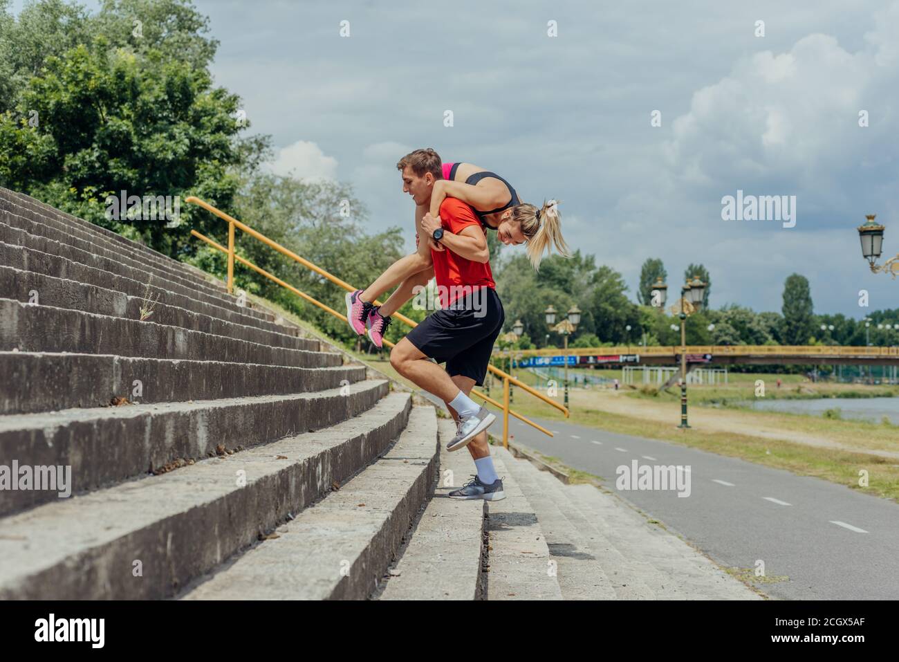 Two friends run up stairs hi-res stock photography and images - Alamy