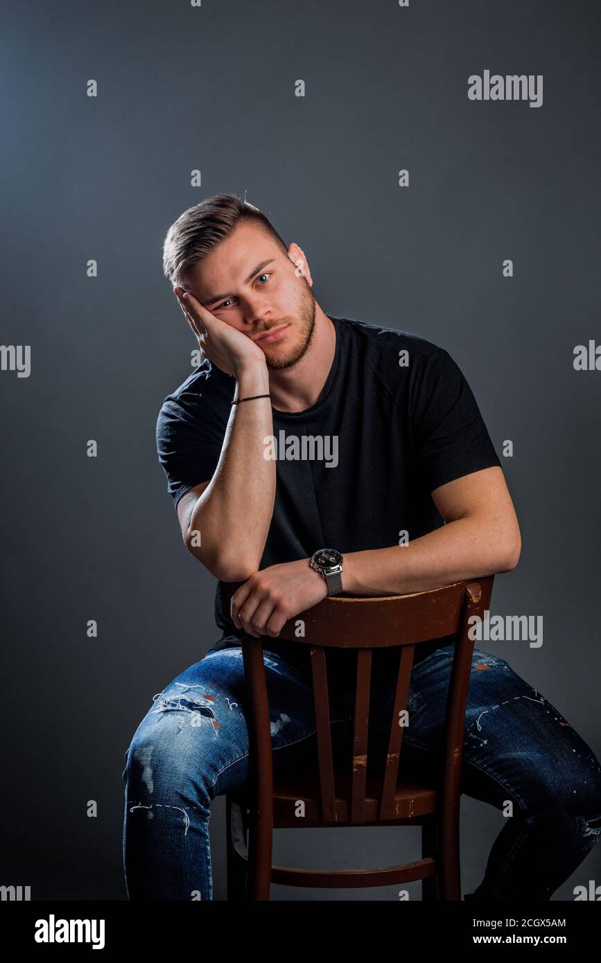 Portrait of a handsome male model posing in cool fashionable clothing ...
