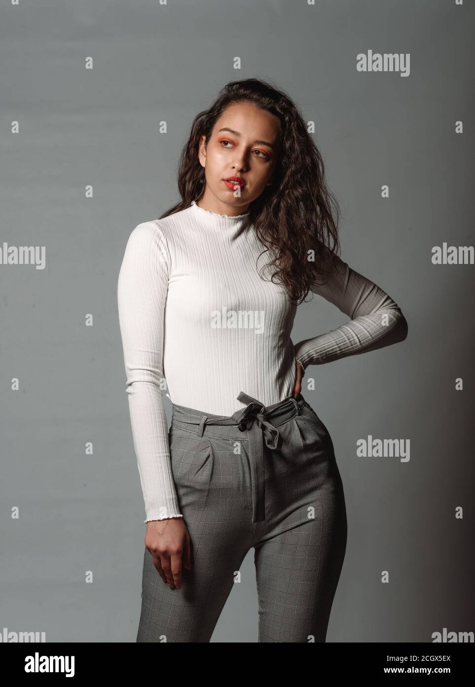 Body shot of an attractive female model dressed in modern clothes Stock ...