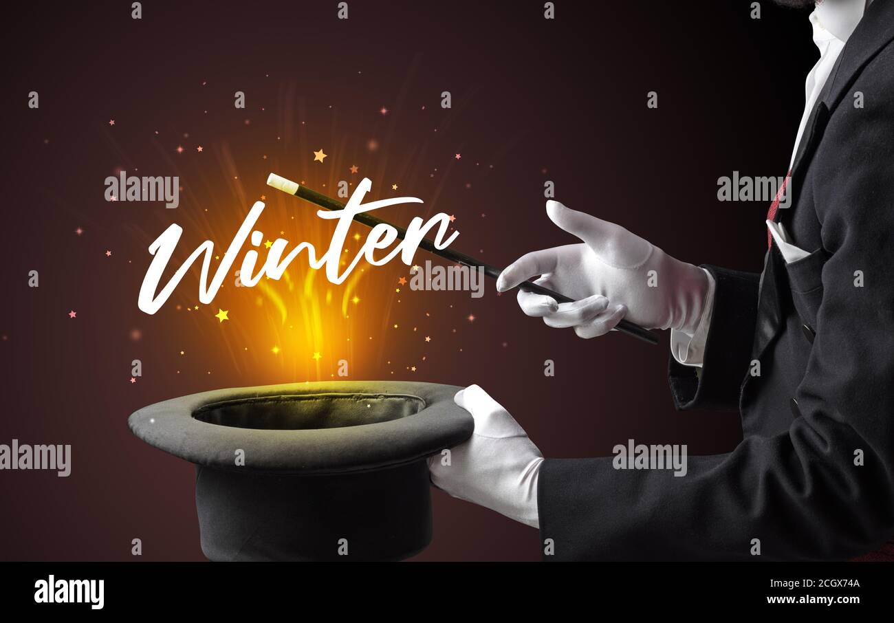 Magician is showing magic trick with Winter inscription, traveling ...