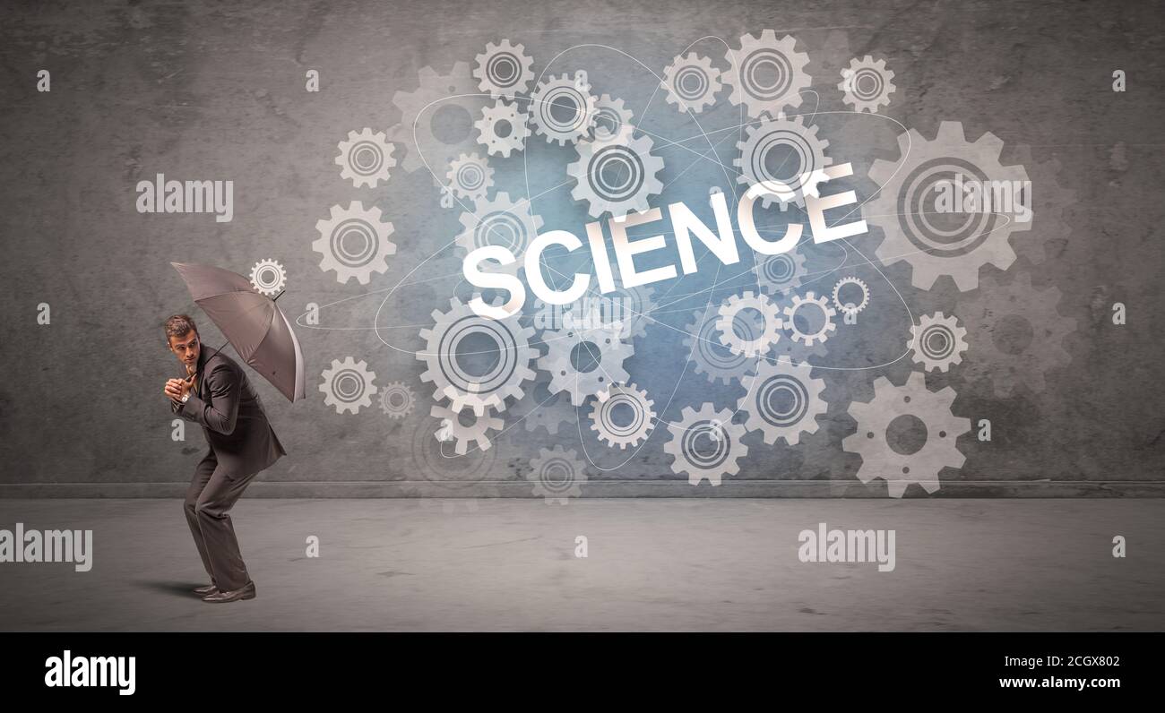 Businessman defending with umbrella from SCIENCE inscription ...