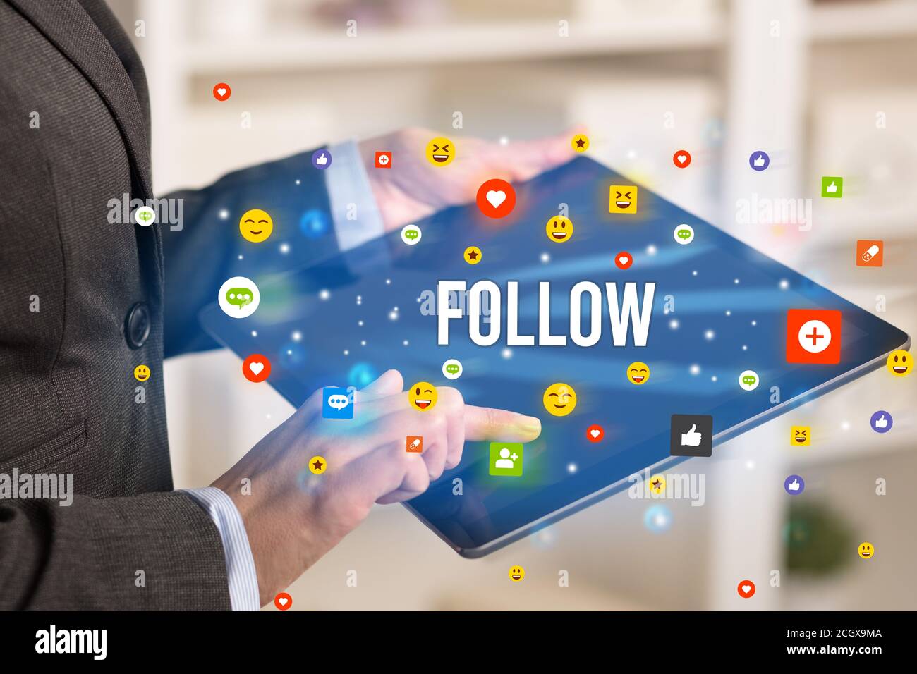 Close up of business person playing multimedia with social media icons ...