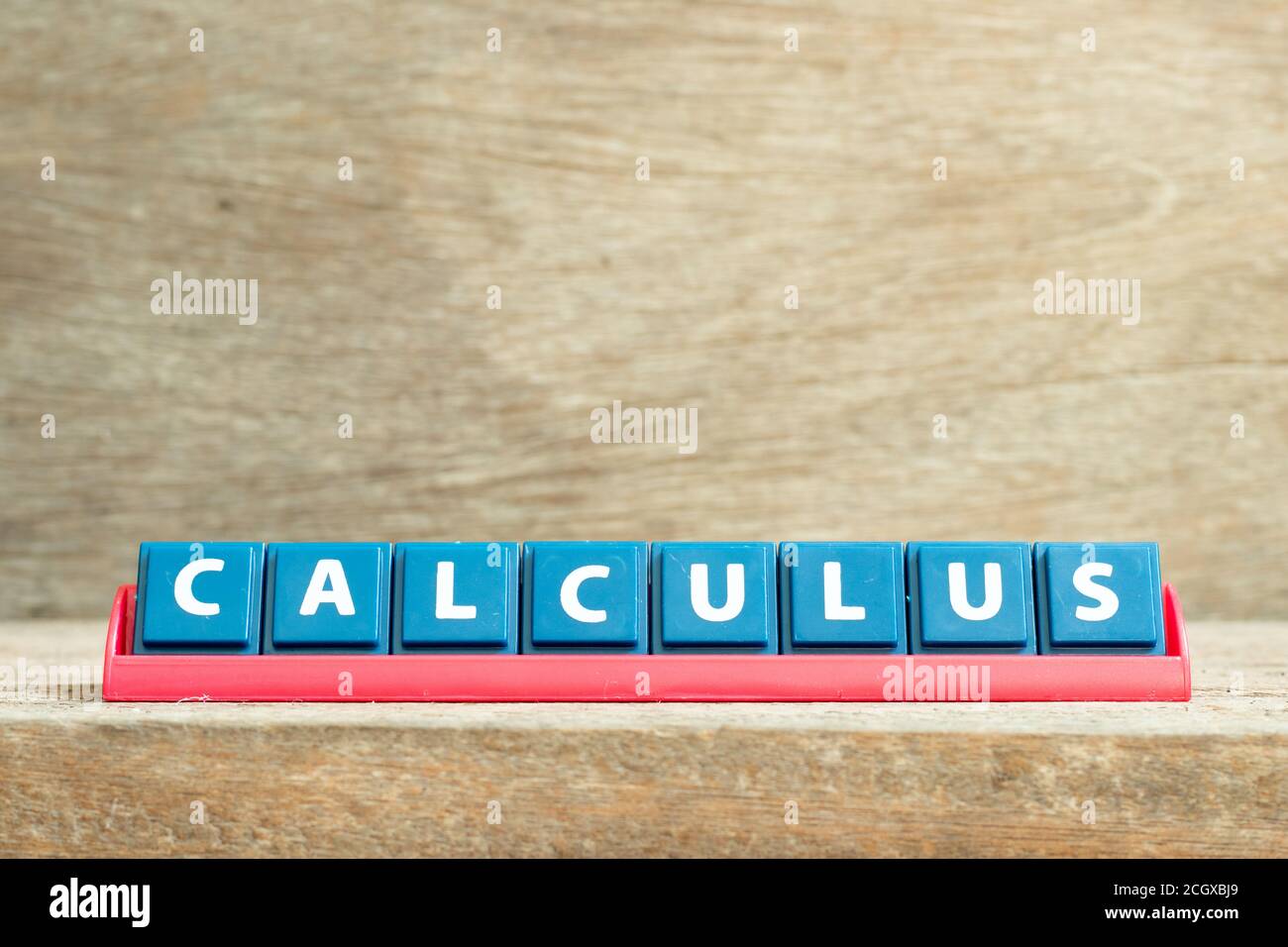 Tile letter on red rack in word calculus on wood background Stock Photo ...