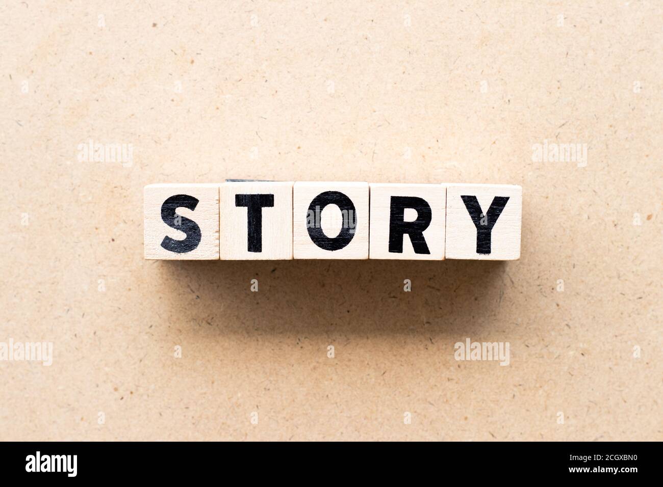 Letter block in word story on wood background Stock Photo - Alamy