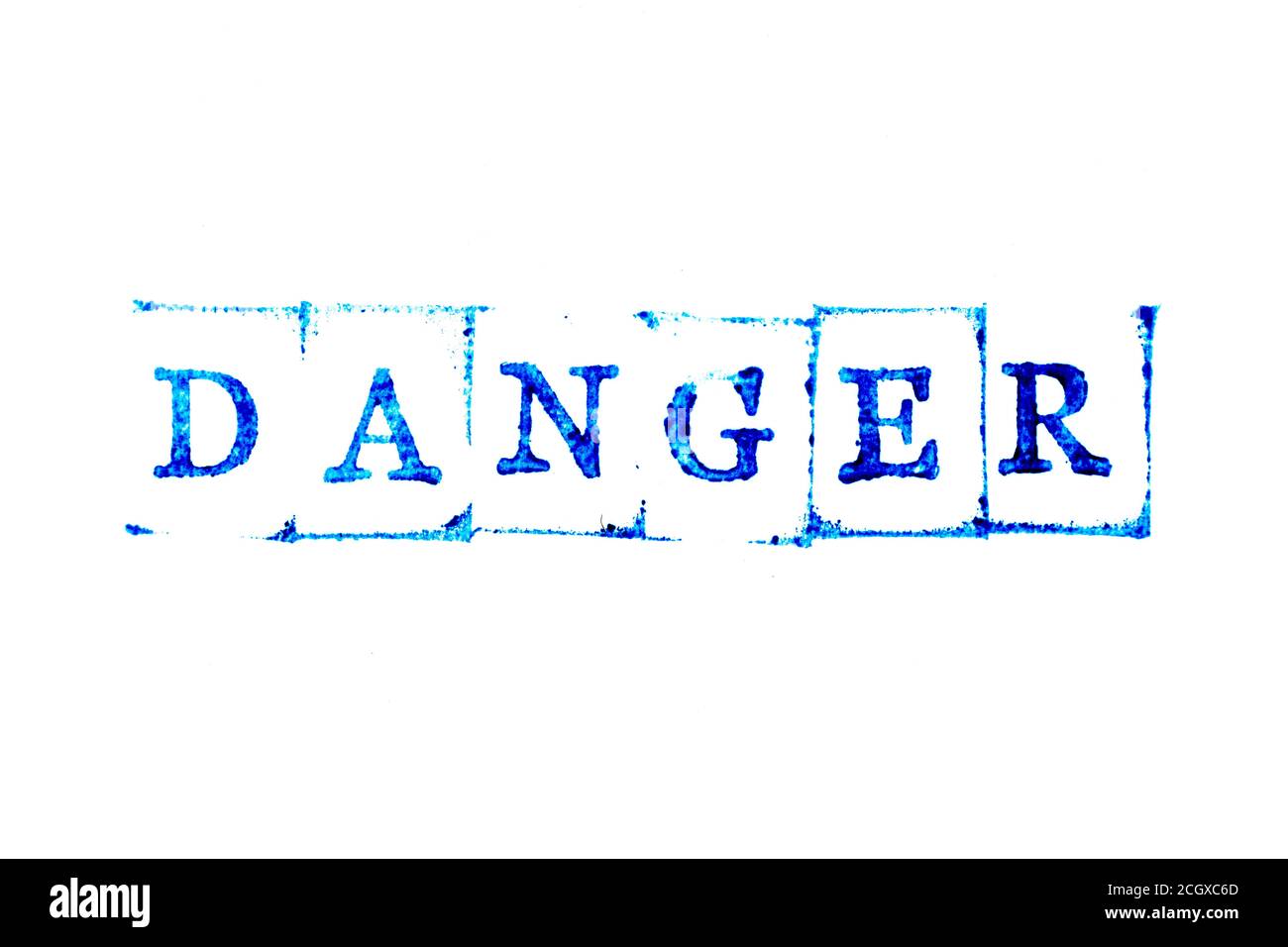 Blue color ink of rubber stamp in word danger on white paper background ...