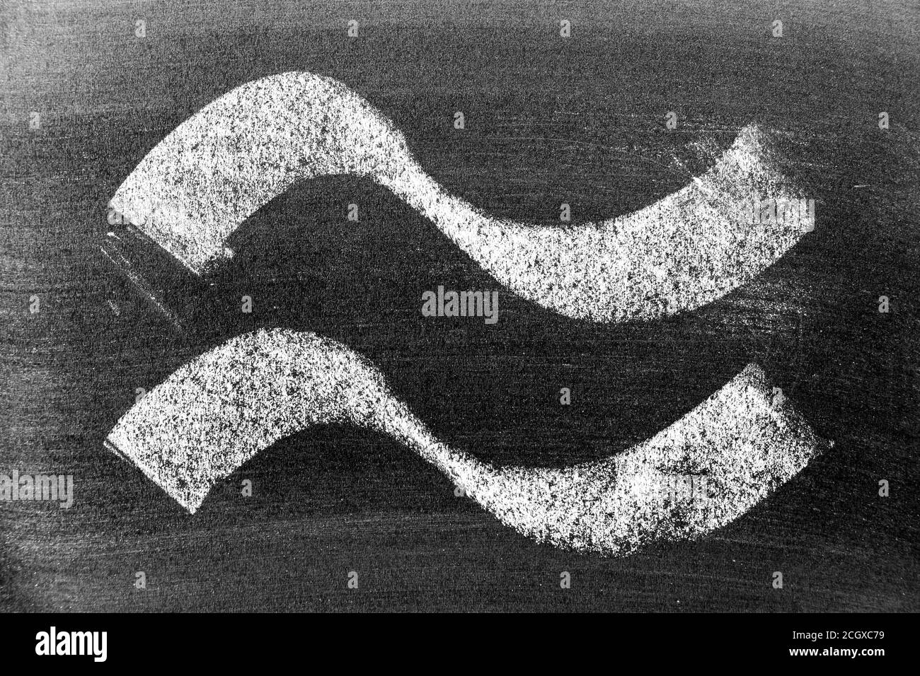 White color chalk hand drawing in set of curve or wavy line shape on ...