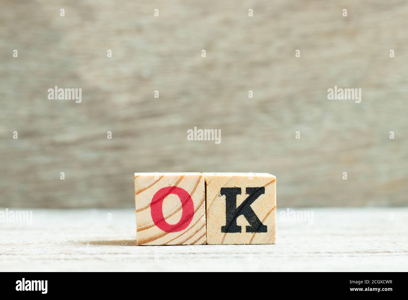 Alphabet letter in word ok on wood background Stock Photo - Alamy