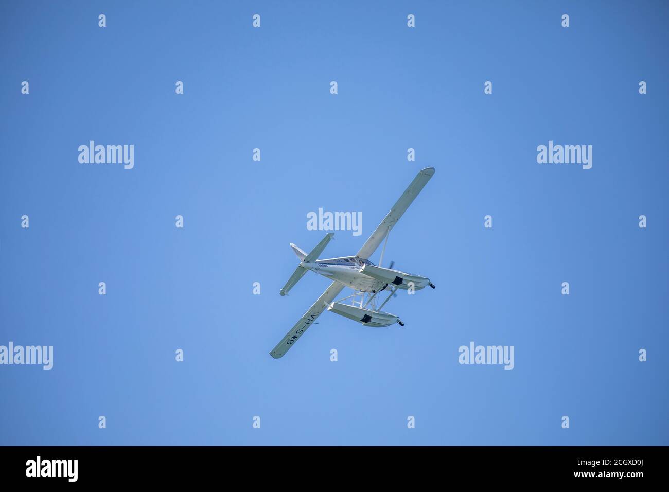 Sydney seaplane flying against blue sky after taking off from Palm ...