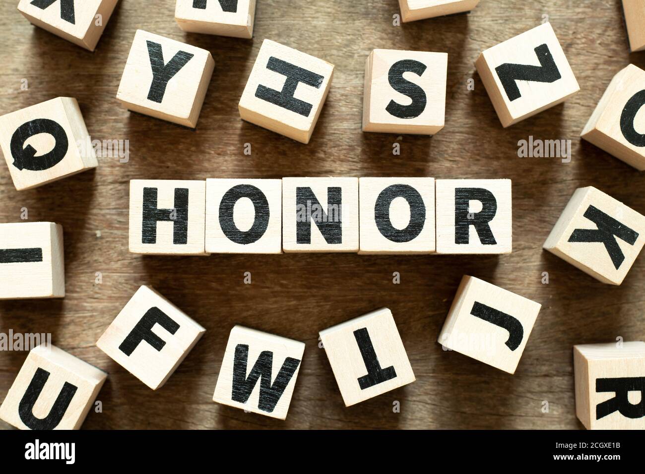 Letter block in word honor with another block on wood background Stock ...