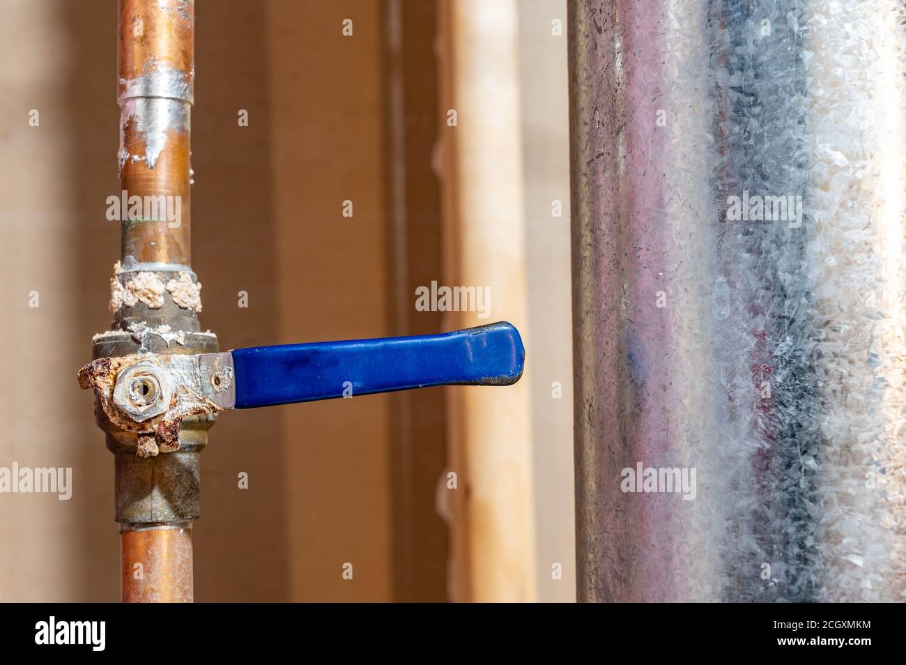 hot water line with a ball valve heavily rusted and damaged Stock Photo ...