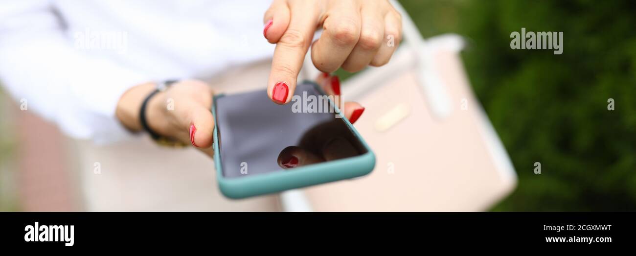 Woman points finger smartphone hi-res stock photography and images - Alamy