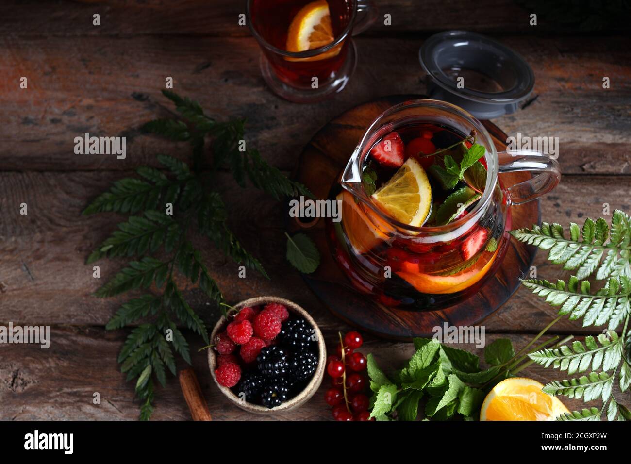 fruit berry tea in a glass teapot Stock Photo - Alamy