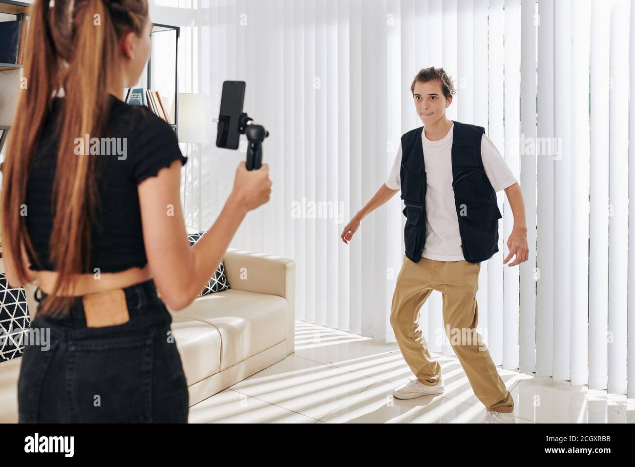 Teenagers filming dance video Stock Photo - Alamy