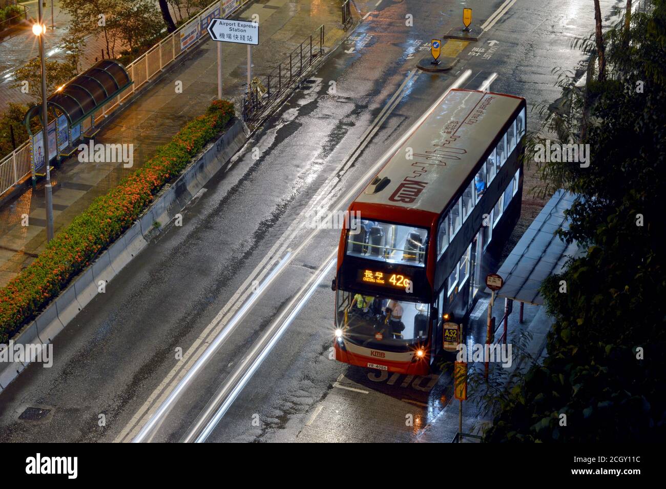 Public bus at bus stop at night in Tsing Yi, Hong Kong Stock Photo - Alamy